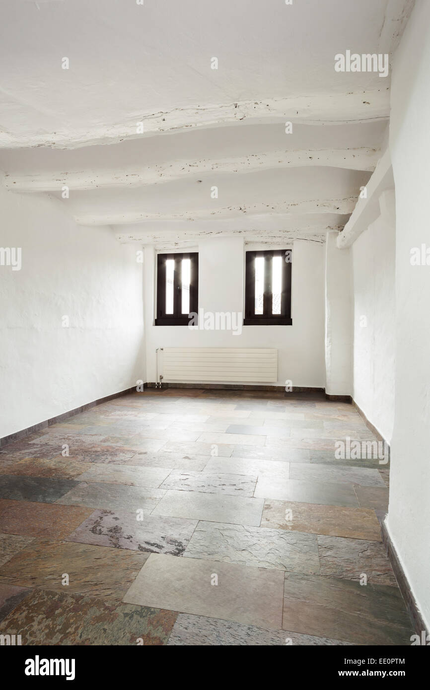 interior rustic house, room with two small windows Stock Photo - Alamy