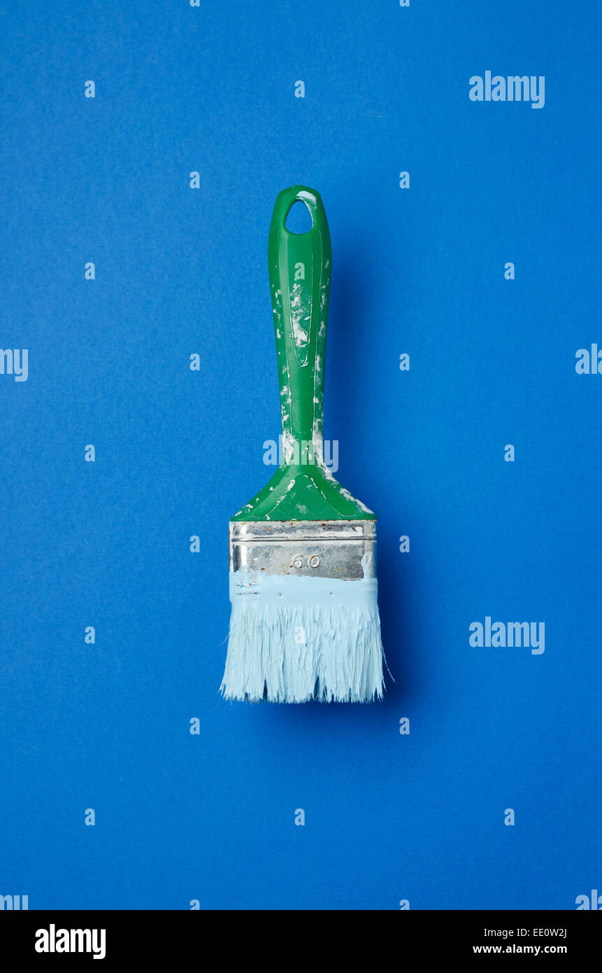 Used paintbrush over light blue background, above view Stock Photo - Alamy