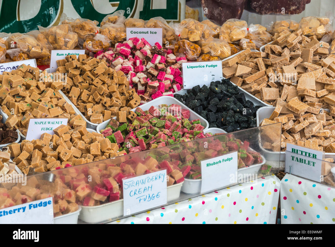 Selection of fudge and candy sweets for sale on a market stall ...