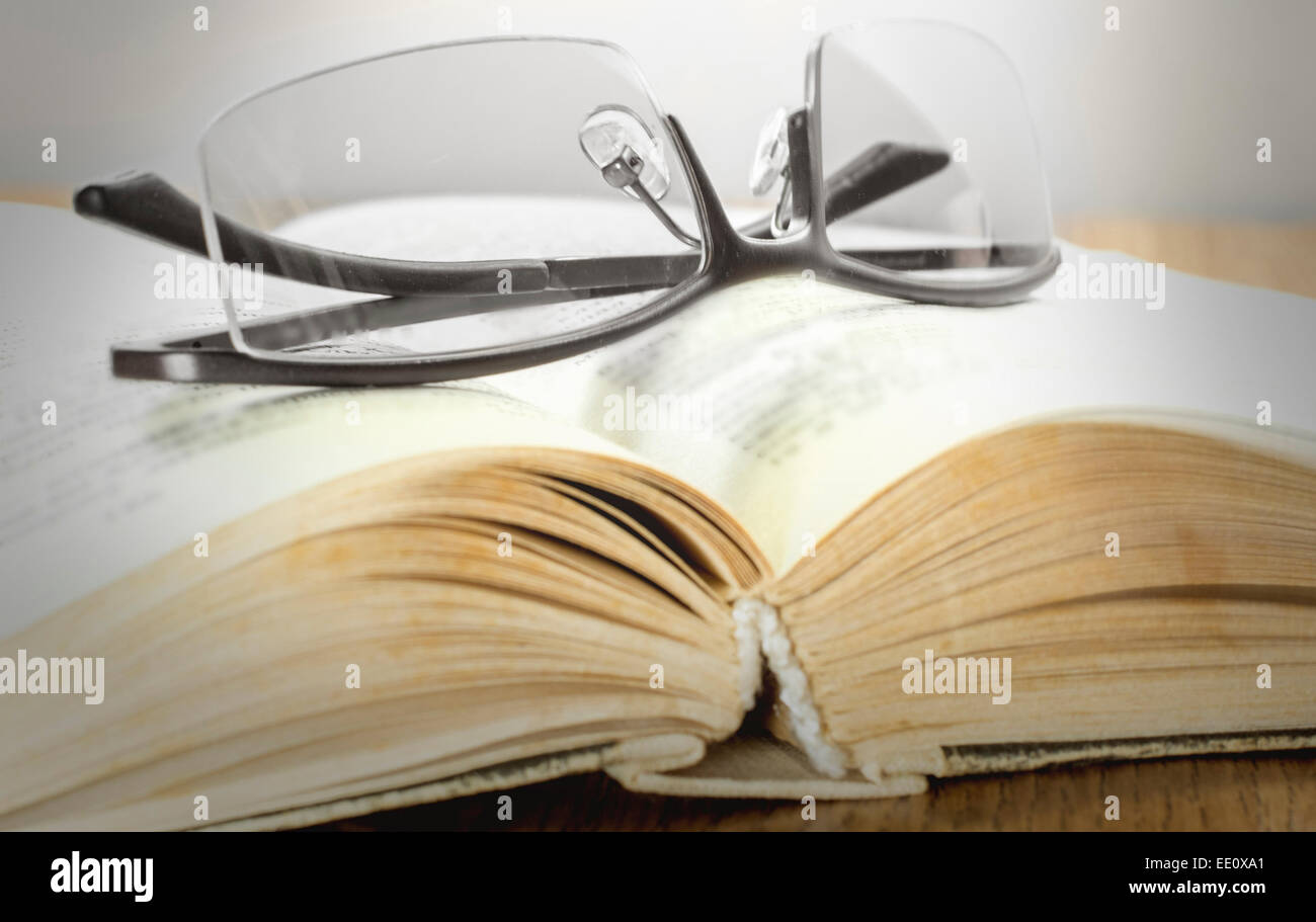 Open book with glasses hi-res stock photography and images - Alamy