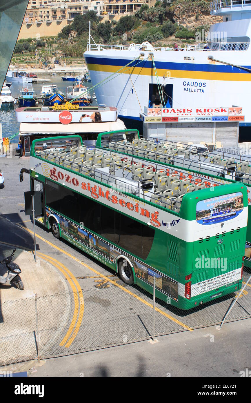Sightseeing open top bus waiting for passengers from the ferry moored ...