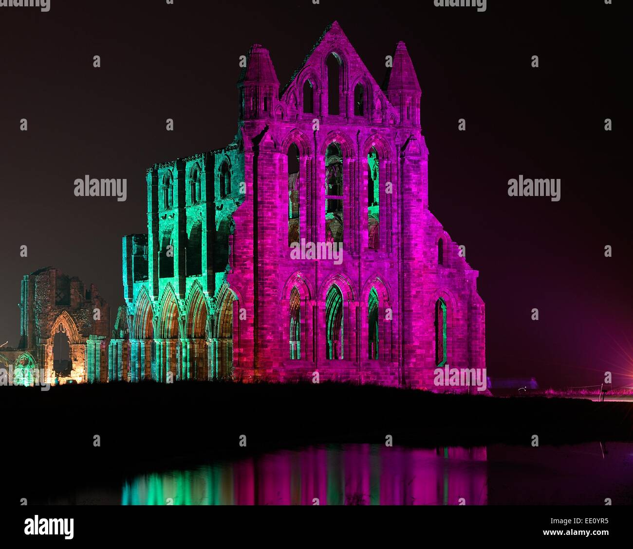 Whitby Abbey illuminated at night Stock Photo - Alamy