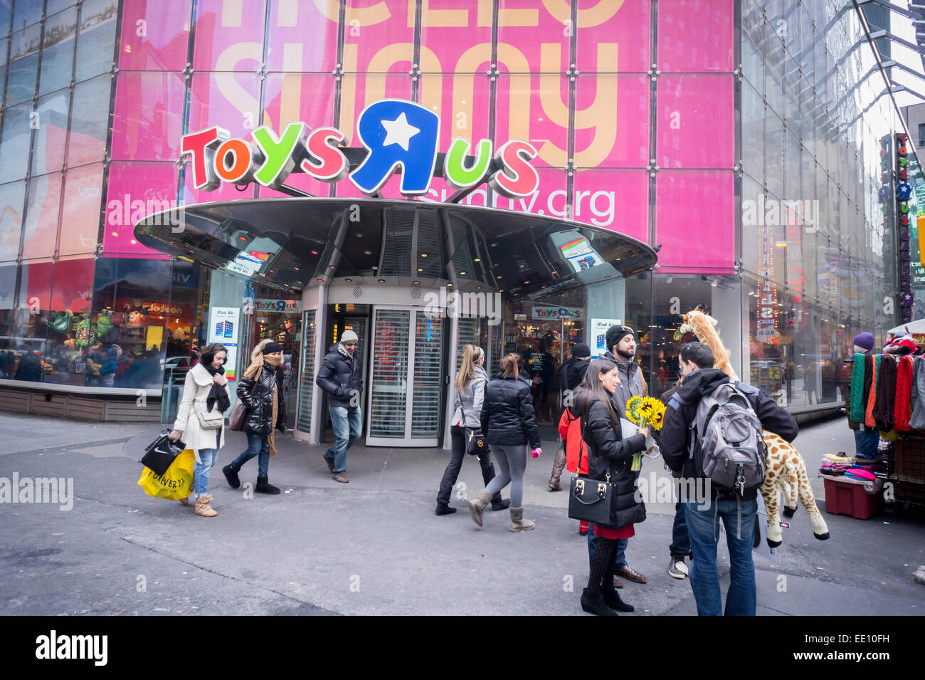 Shoppers in front of Toys R Us in busy Times Square in New York on ...