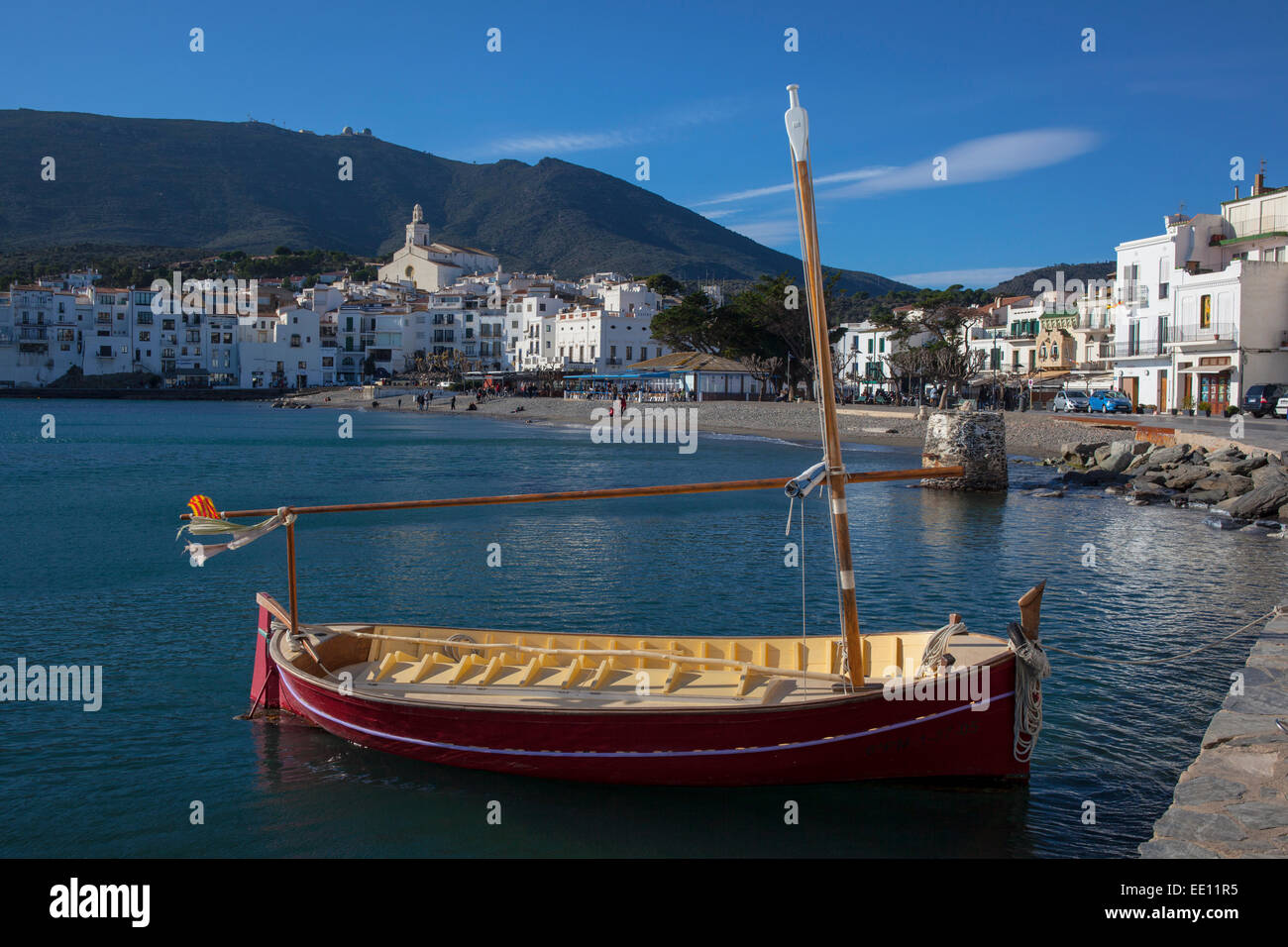 Traditional Llagut sailing boat on the seafront in Cadaques, Catalonia ...
