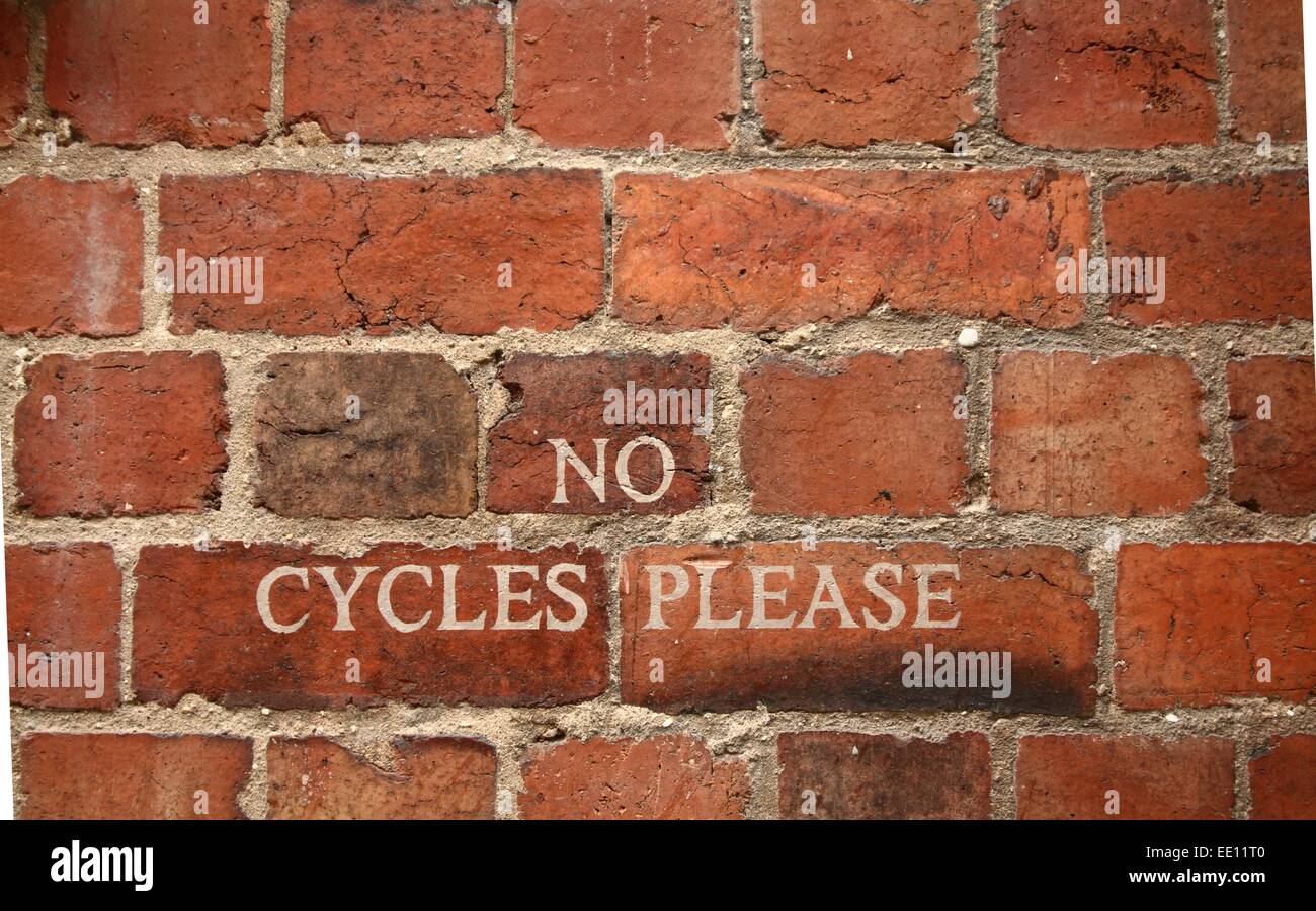 "No cycles please" sign on a brick wall Stock Photo - Alamy