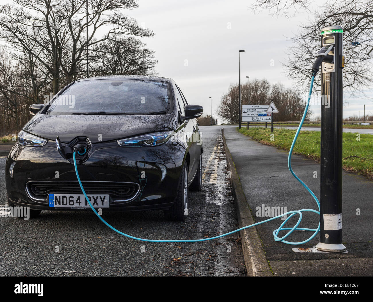 Electric motor car charging Stock Photo - Alamy