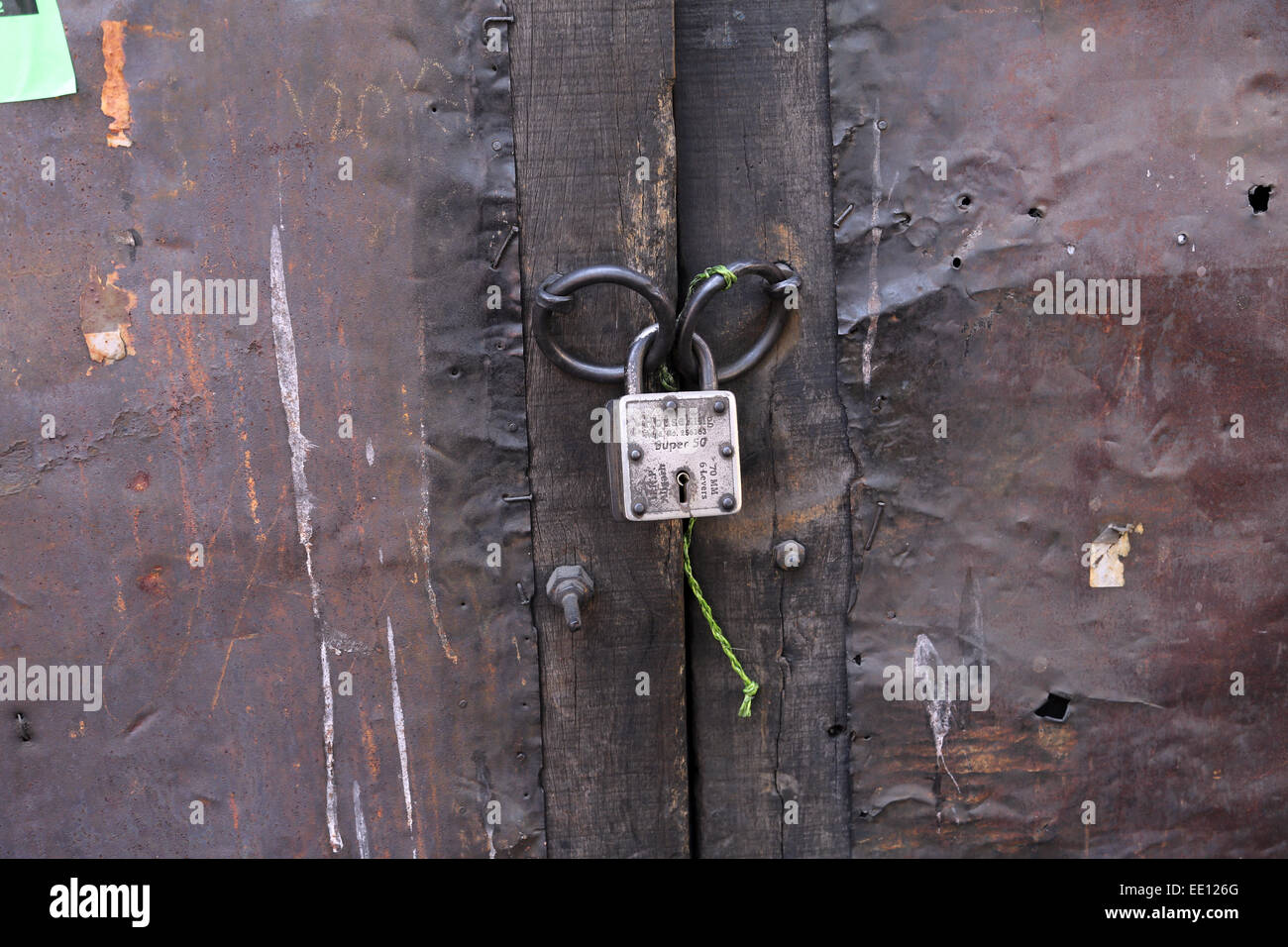 Metal rusty door with padlock Stock Photo - Alamy