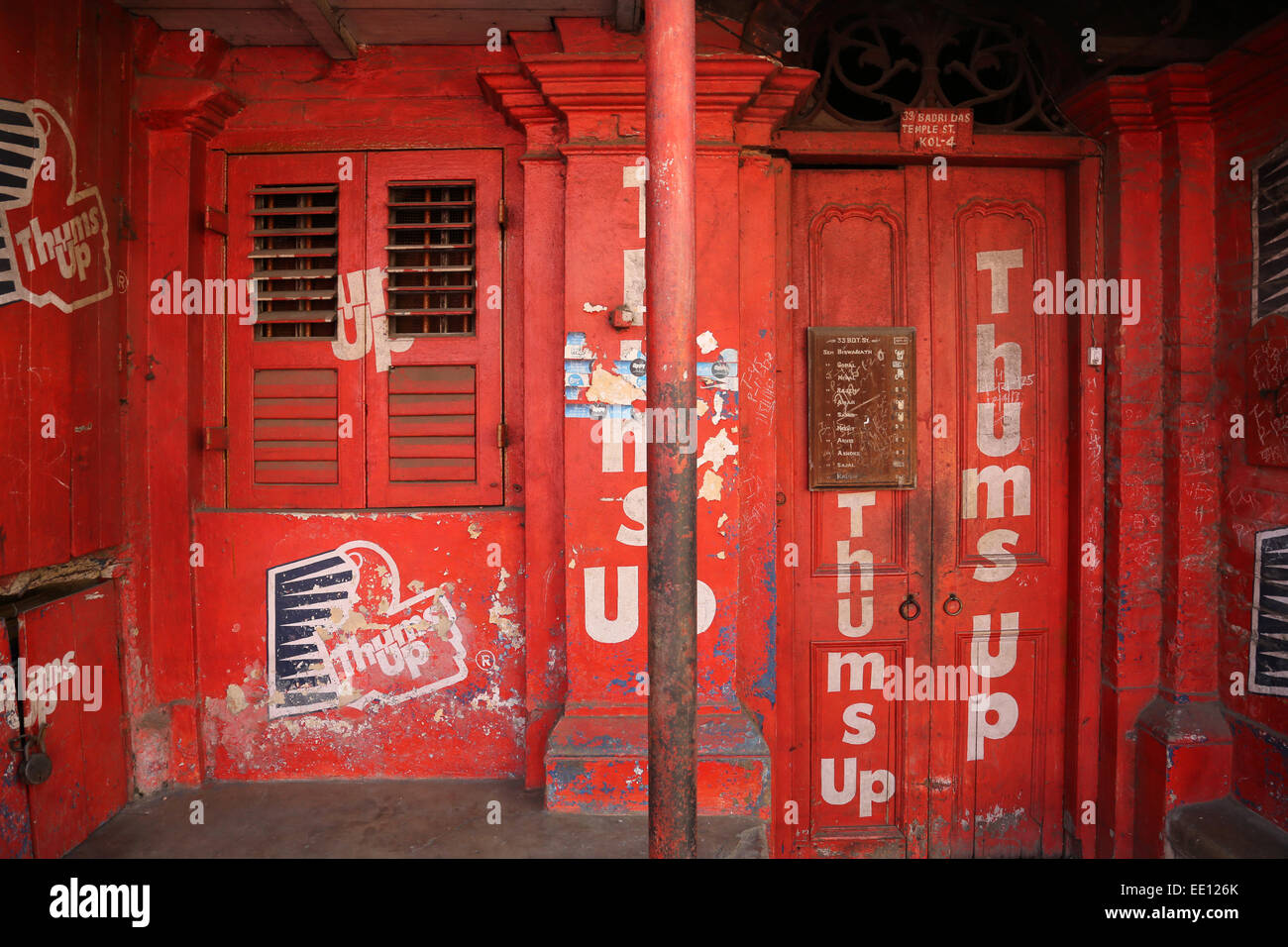 Colorful Indian house. Bright red building in Kolkata, West Bengal ...