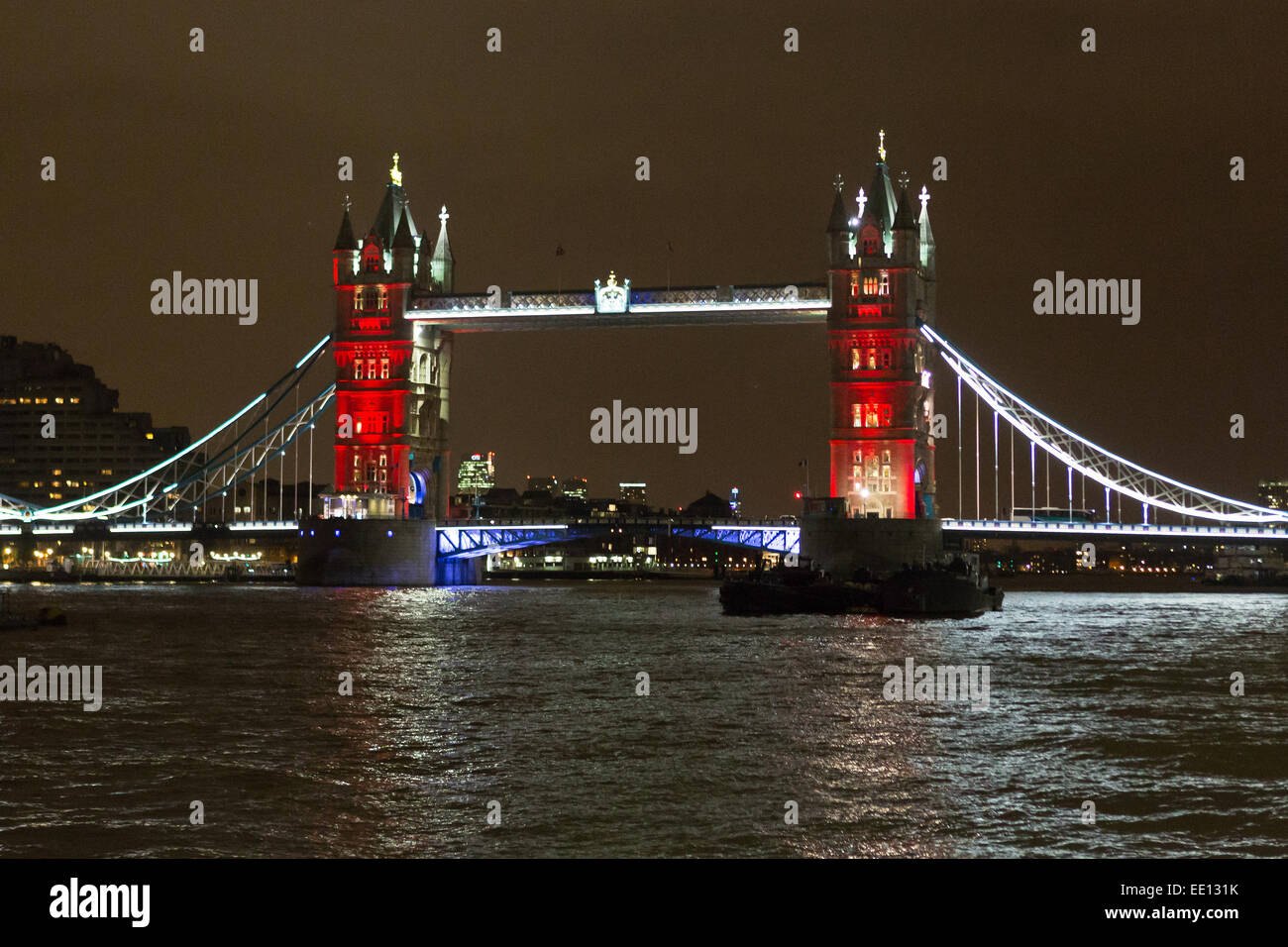 London, UK. 11th Jan 2015. Tower Bridge, seen here in red, is ...