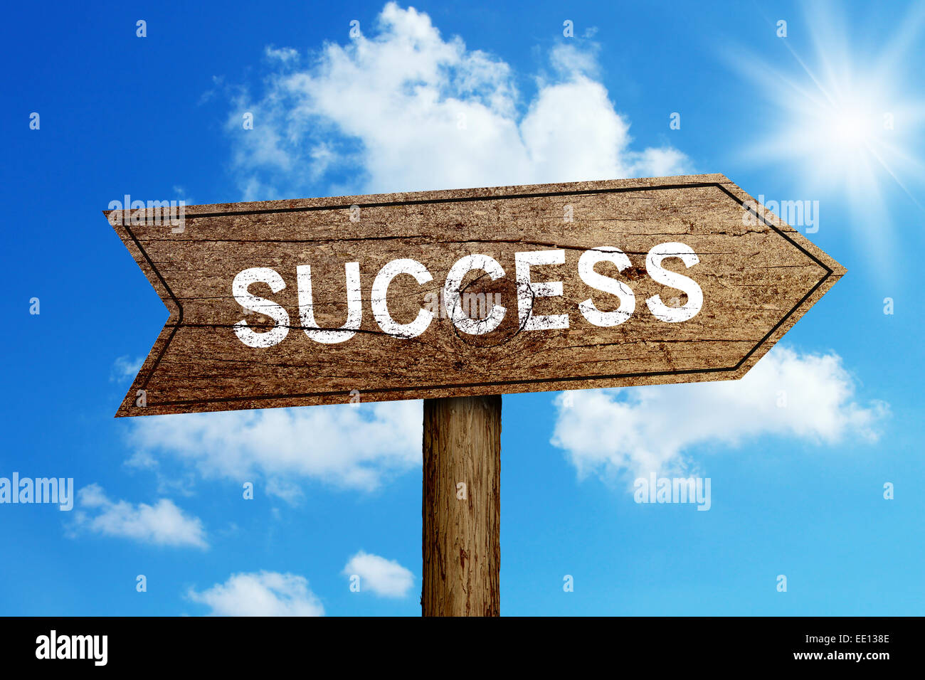 Success wooden road sign with shining blue sky background Stock Photo ...