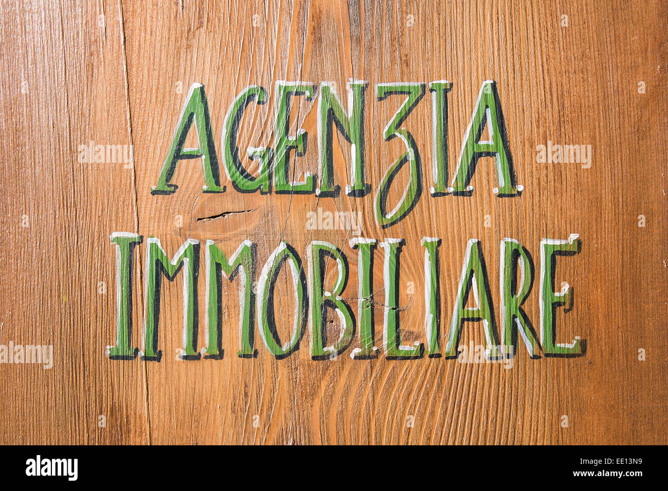 real estate agency wooden sign Stock Photo - Alamy