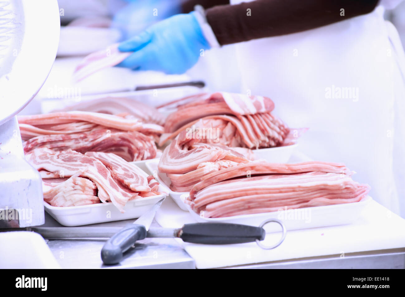 butcher packing pork in meat industry Stock Photo - Alamy