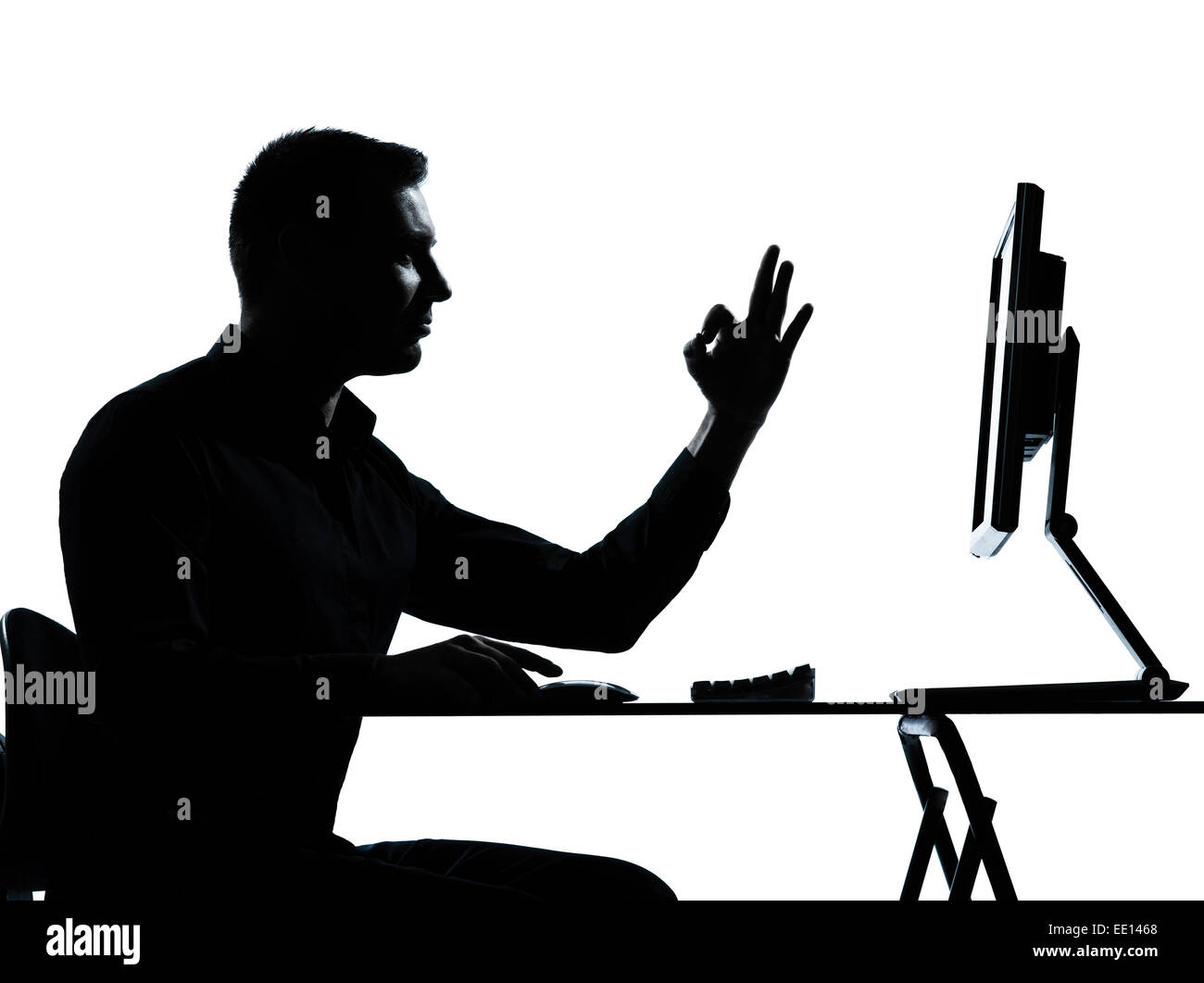 one caucasian business man computer computing ok gesture silhouette in ...
