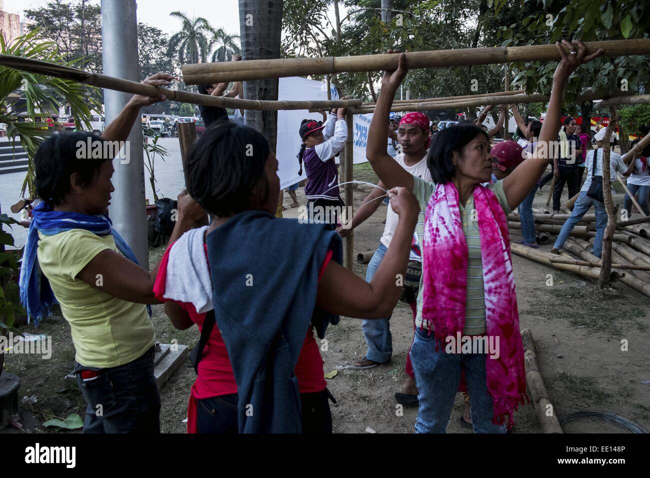 Peasants from southern tagalog build their temporary shelter at the ...