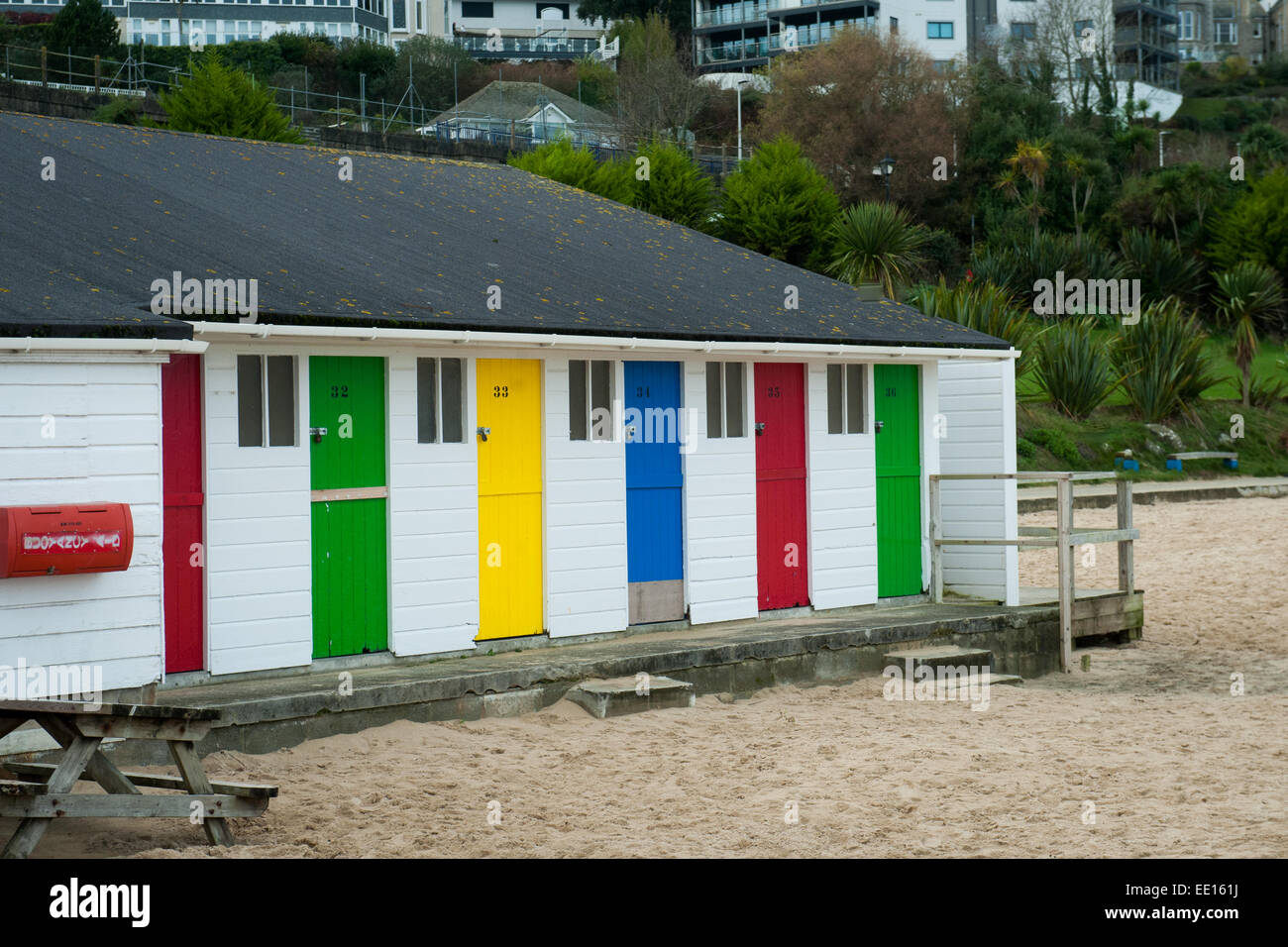 Brightly coloured beach huts on Porthminster Beach, St. Ives in ...