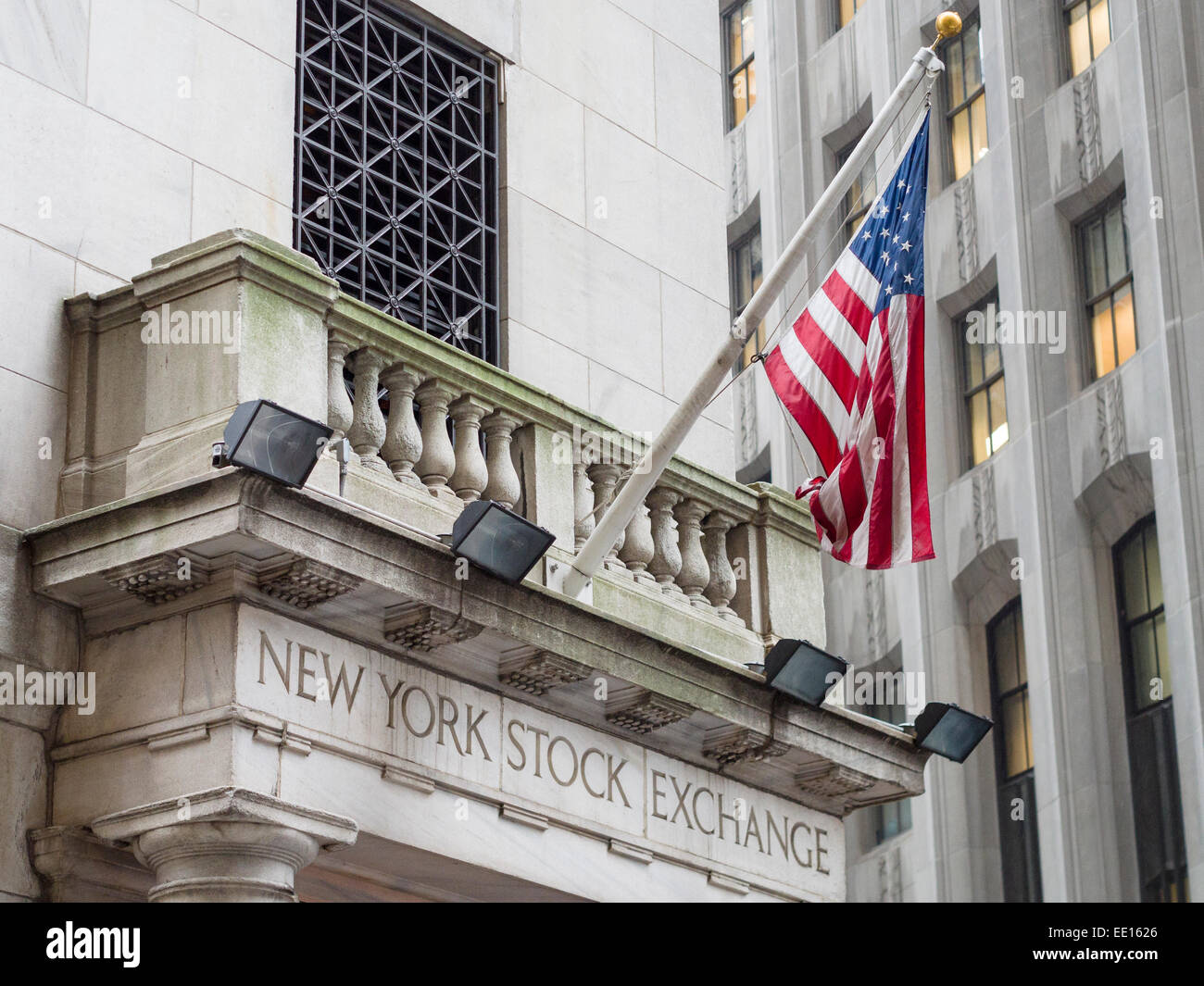 New York Stock Exchange with US Flag. Side entrance to the New York ...
