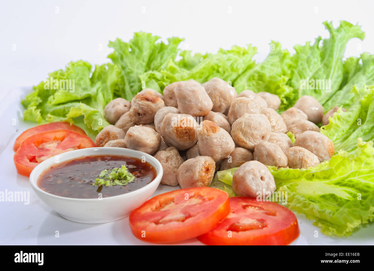 fried meat ball and vegetable on white dish Stock Photo - Alamy