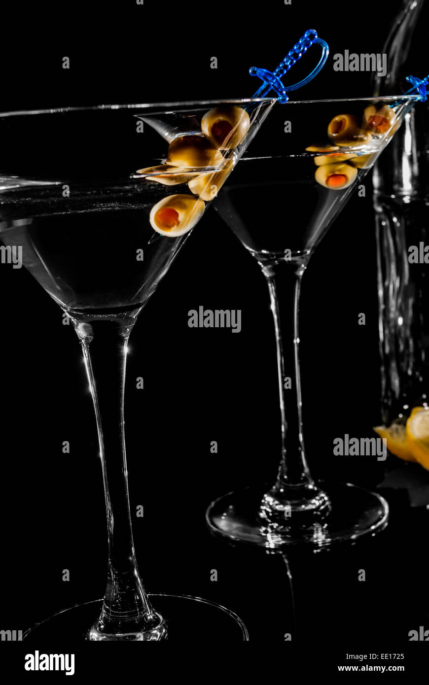 Martini glass with olive on black background Stock Photo - Alamy