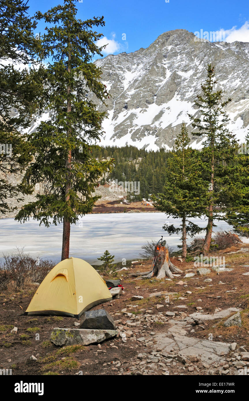 Camping scene with Tent in mountains Stock Photo - Alamy