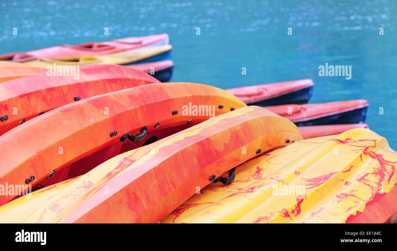 Colourful yellow and red kayaks on turquoise sea water background Stock ...
