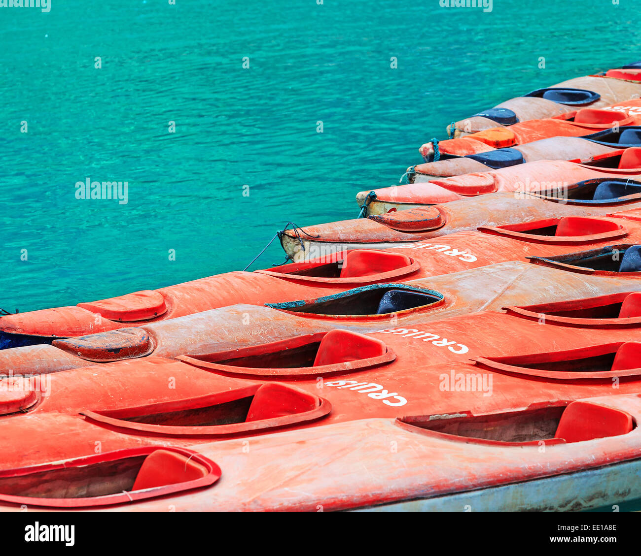 Colourful yellow and red kayaks on turquoise sea water background Stock ...