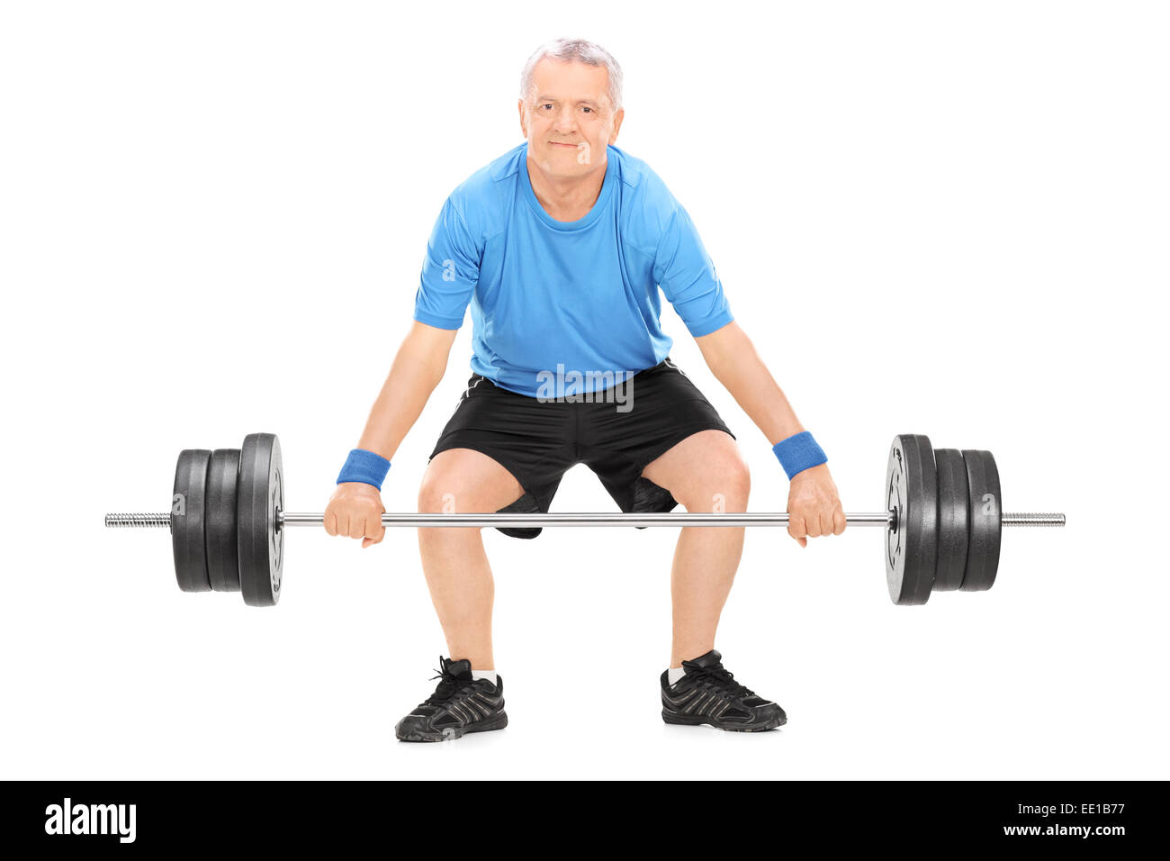 Strong mature man lifting a heavy weight isolated on white background ...