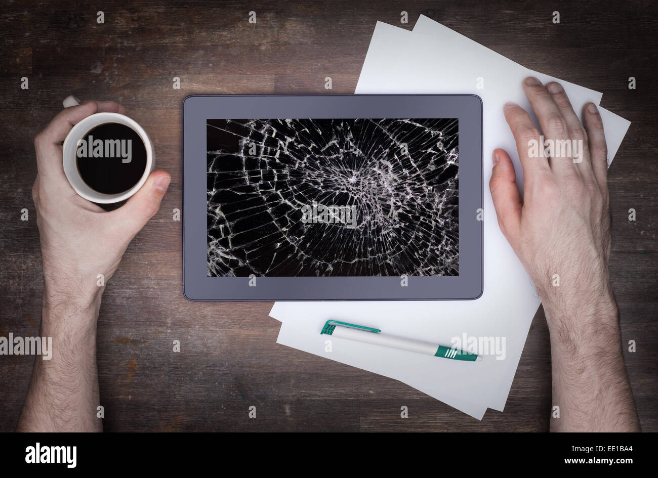 Tablet computer with broken glass, screen destroyed Stock Photo - Alamy