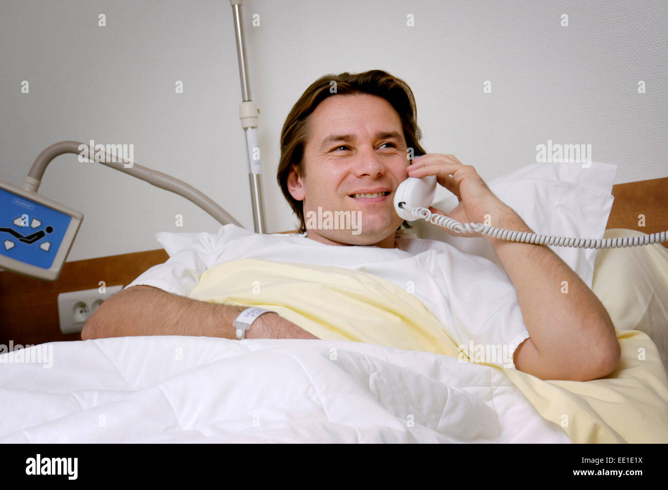 Man lying in hospital bed hi-res stock photography and images - Alamy