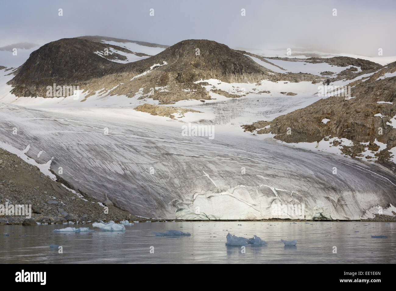 View of coastal glacier terminus and mountains, Raudfjorden ...