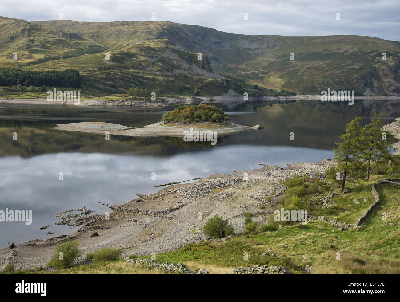 View of upland reservoir with low water level and remains of submerged ...