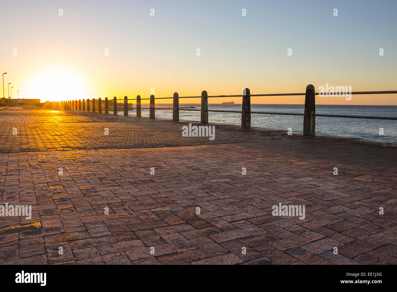 Promenade walkway at sunset Stock Photo - Alamy