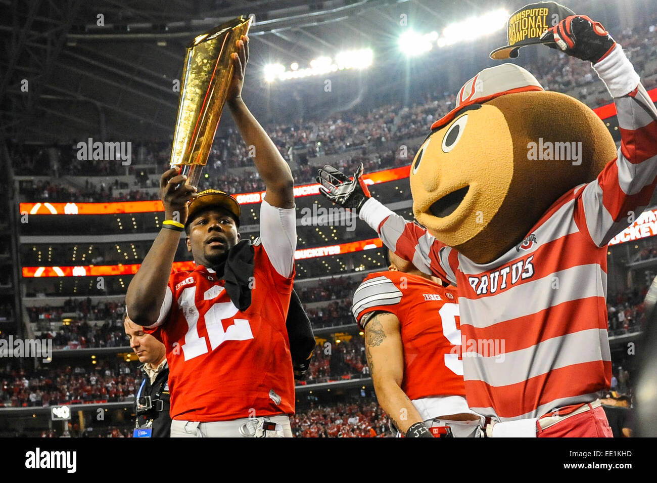 With Ohio State mascot Brutus looking on, quarterback Cardale Jones (12 ...