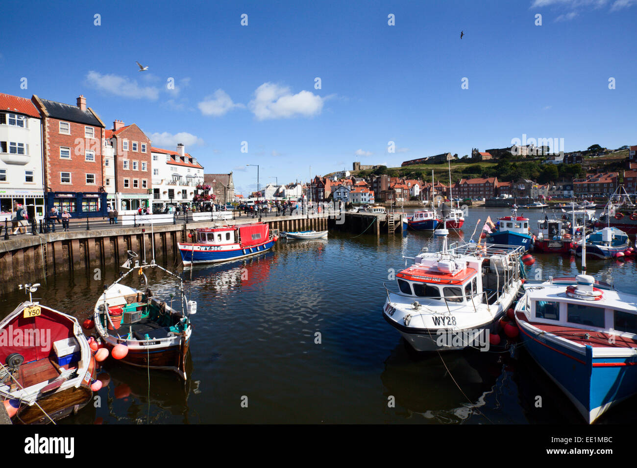 Harbor fishing boats in town whitby england hi-res stock photography ...