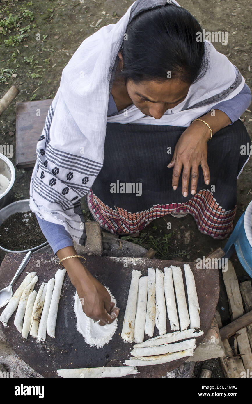 Sivasagar, Assam, India. 13th Jan, 2015. An Assamese woman prepares ...
