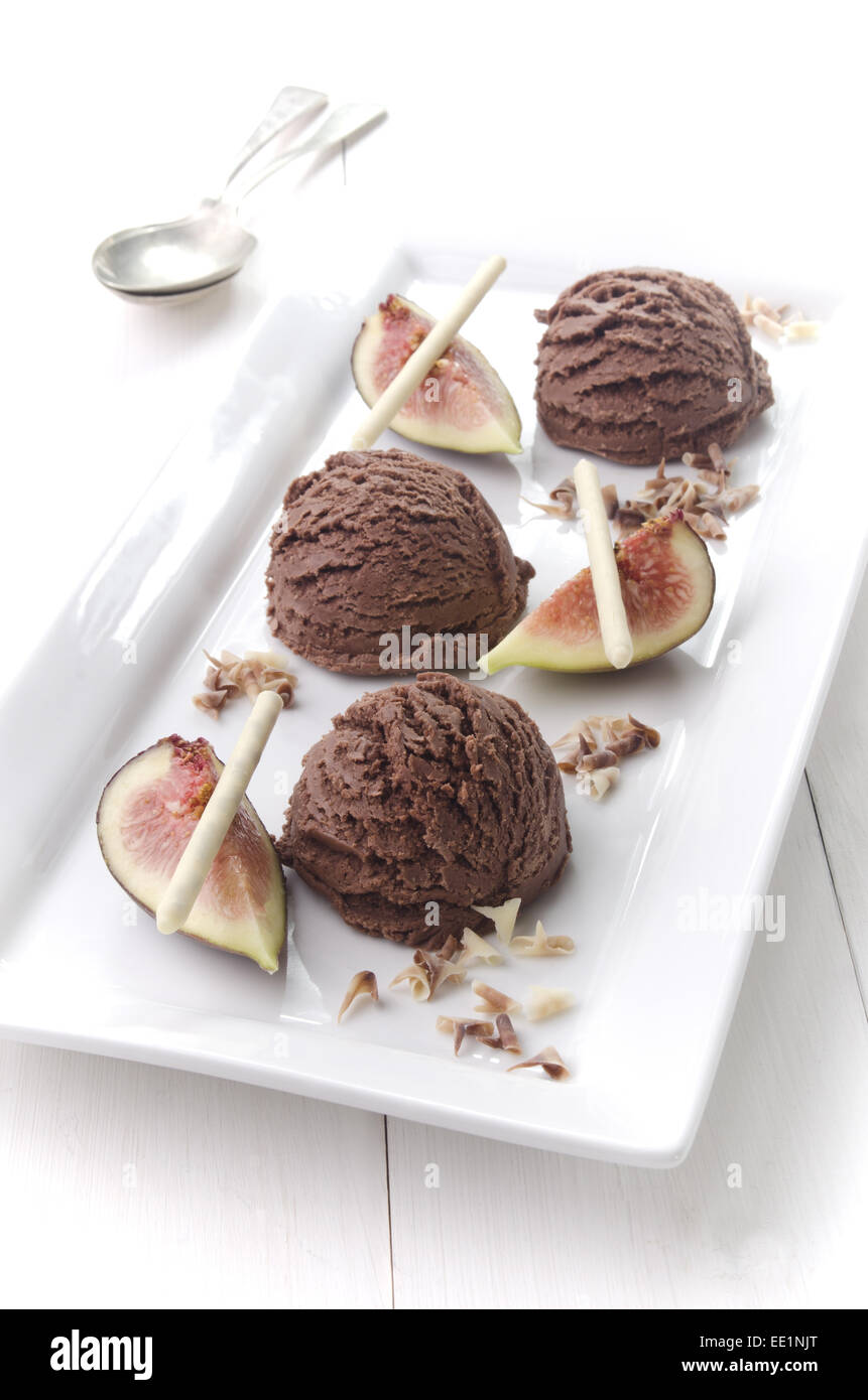 chocolate ice cream with fig, white chocolate sticks and chocolate ...