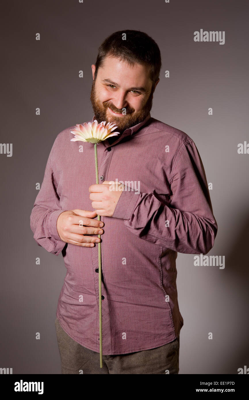 young casual silly man in a dark background Stock Photo - Alamy