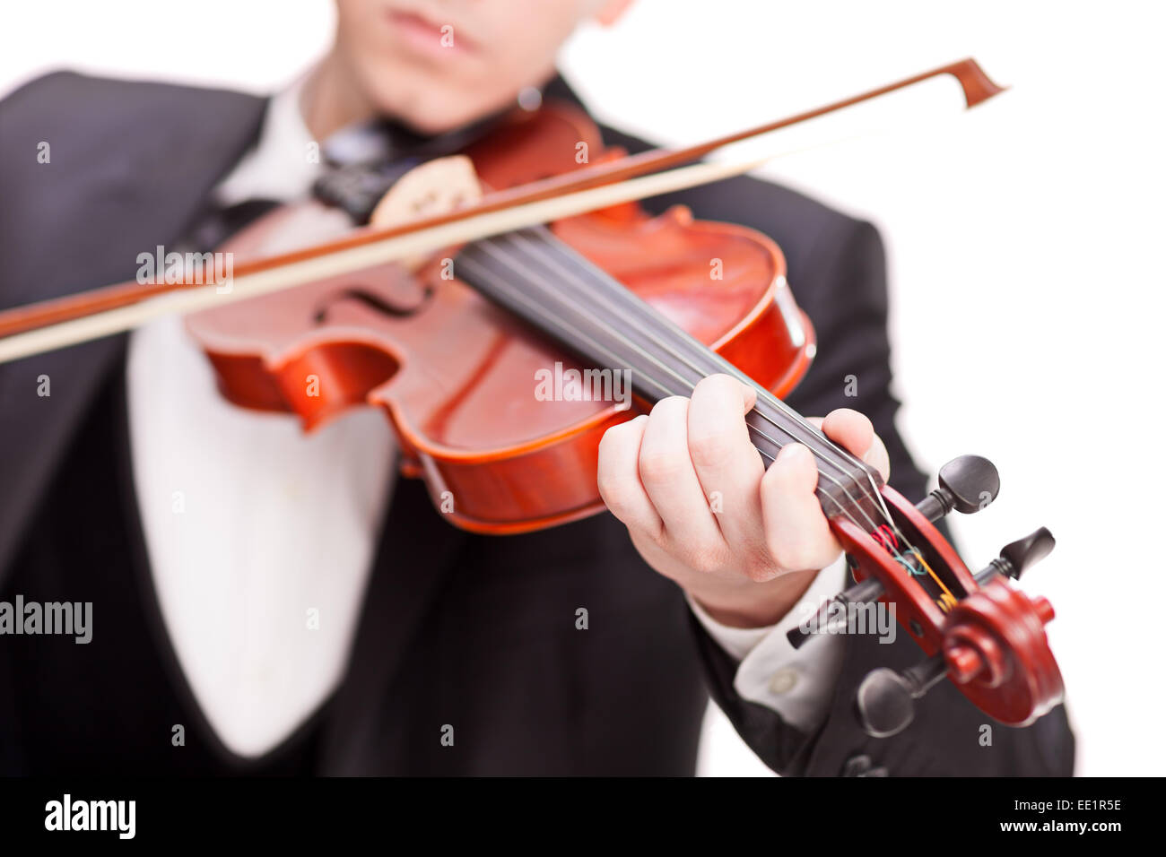 Studio shot of a violinist playing a violin isolated on white ...