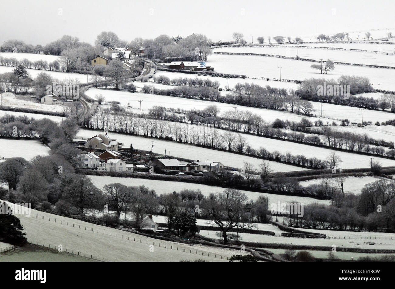 Aberystwyth, Wales, UK. 13th January, 2015. Snow settles on farmland in ...