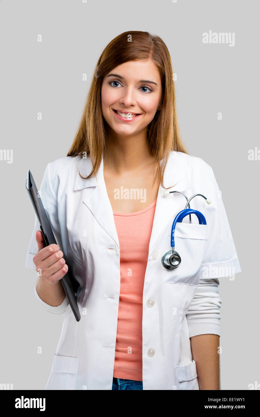 Beautiful and attractive female doctor, isolated over a white ...