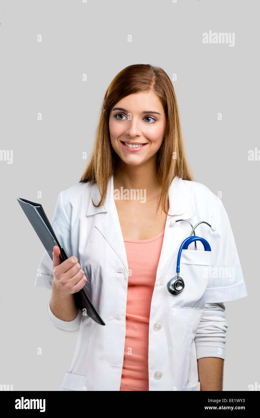Beautiful and attractive female doctor, isolated over a white ...