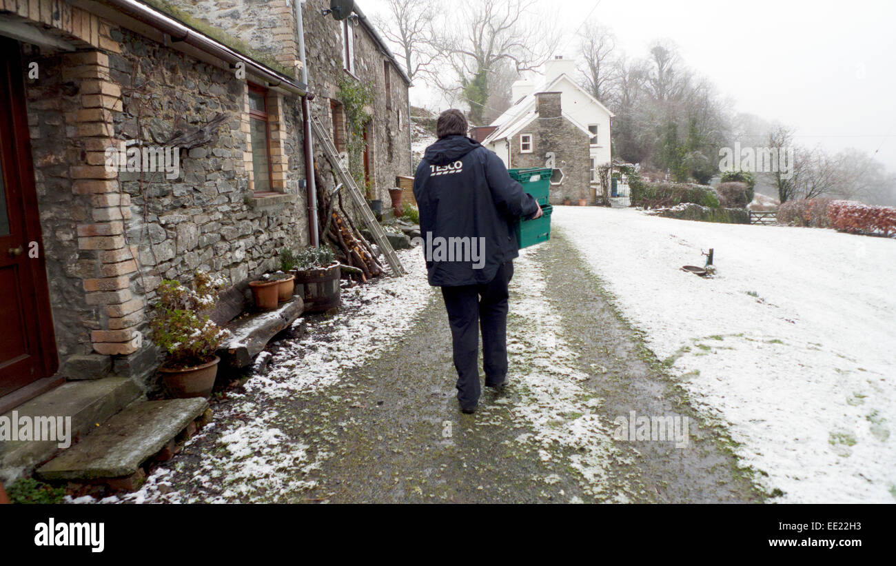 Tesco worker delivery van man delivering groceries to a Carmarthenshire ...