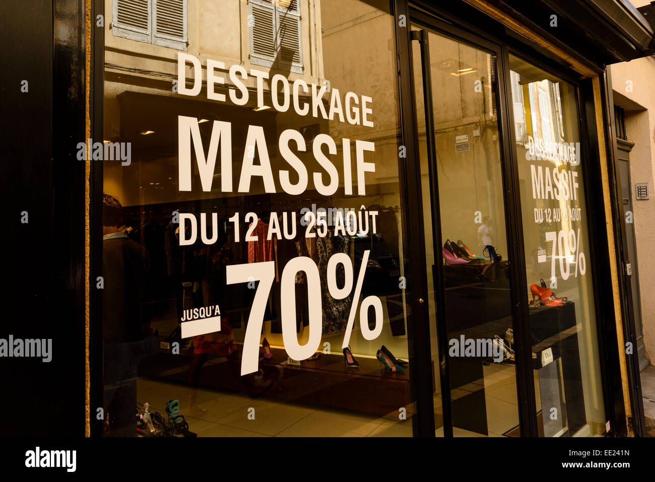 Stock clearance up 75% sale sign in a shoe retail shop in Aix en ...
