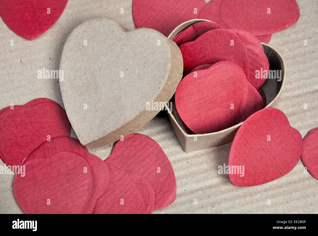 confetti in a recycled cardboard box heart shape on cardboard ...