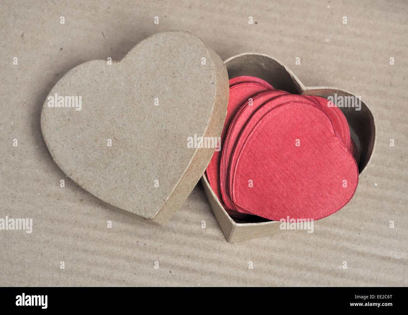 confetti in a recycled cardboard box heart shape on cardboard ...