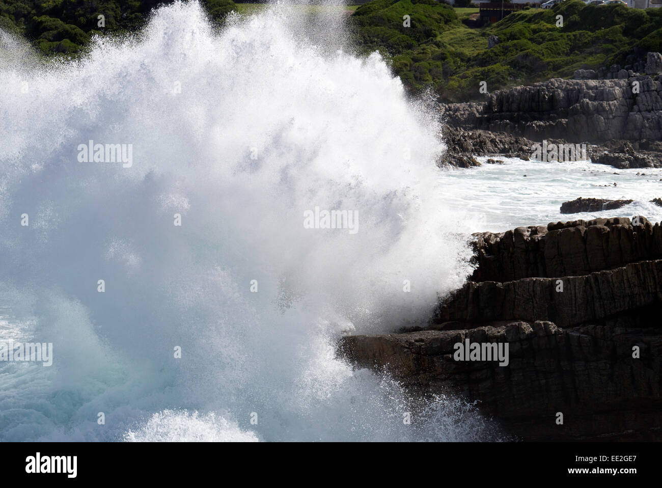 Waves crashing into the cliffs in Hermanus, Western Cape, South Africa ...