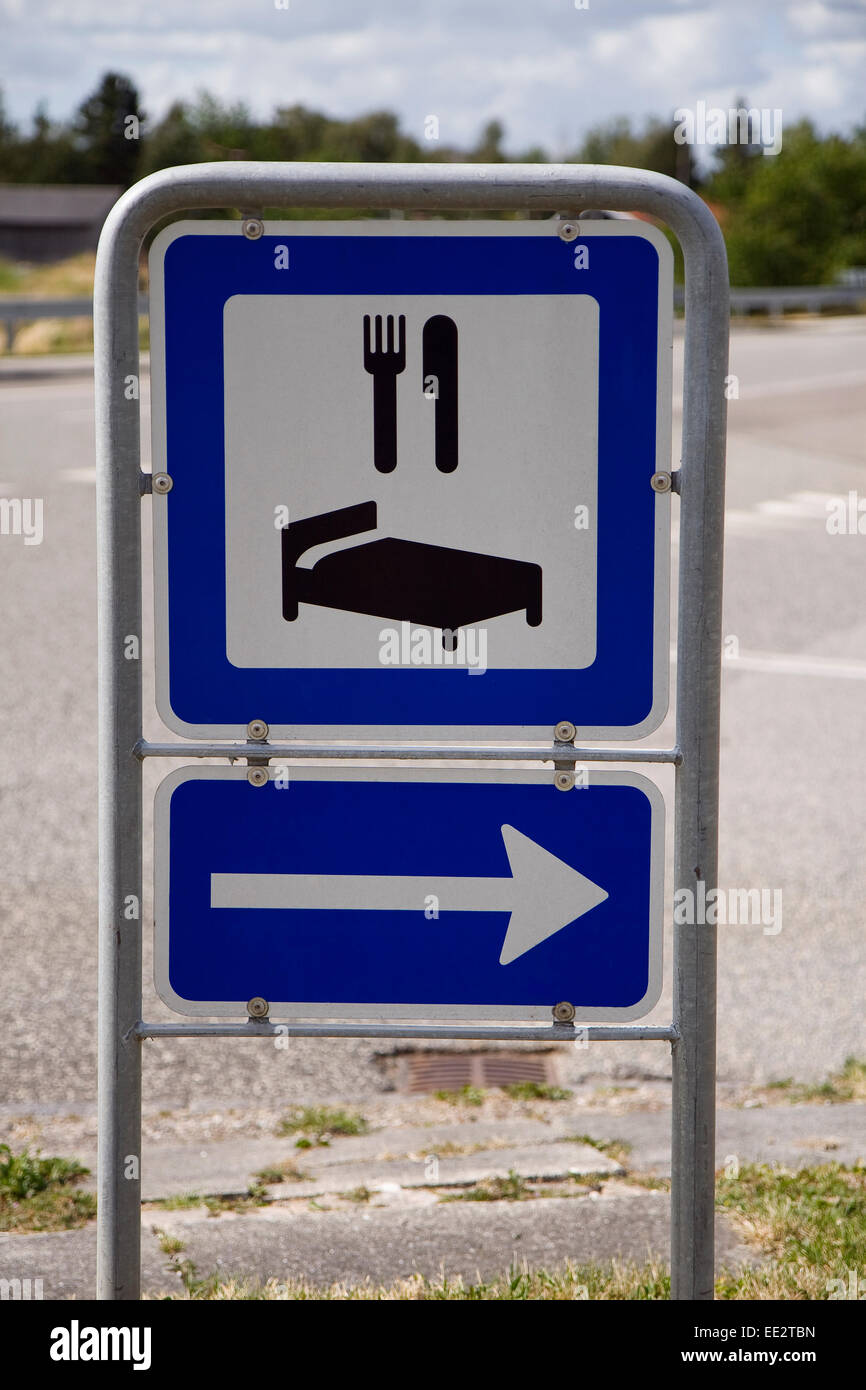 Road sign showing the way to a hotel Stock Photo - Alamy
