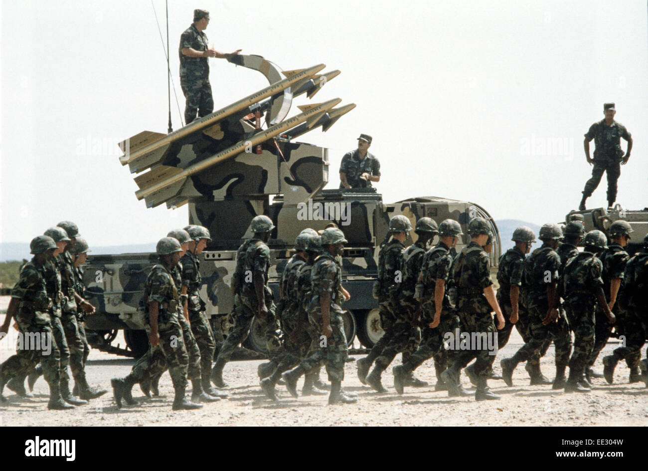 AMAERICAN SOLDIERS MARCHING PAST CHAPARRAL MISSILE LAUNCHER WITH ...