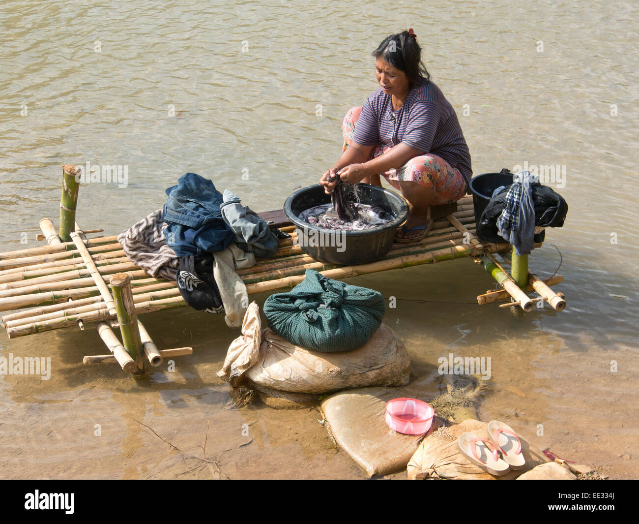 Woman washing clothes in Inle lake, Shan state, Myanmar Stock Photo - Alamy