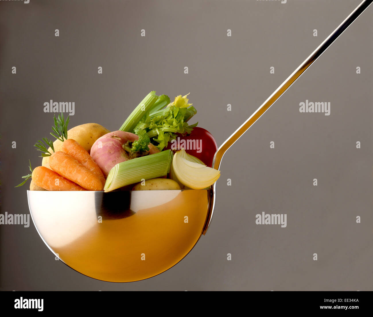vegetable soup ingredients in large ladle Stock Photo - Alamy