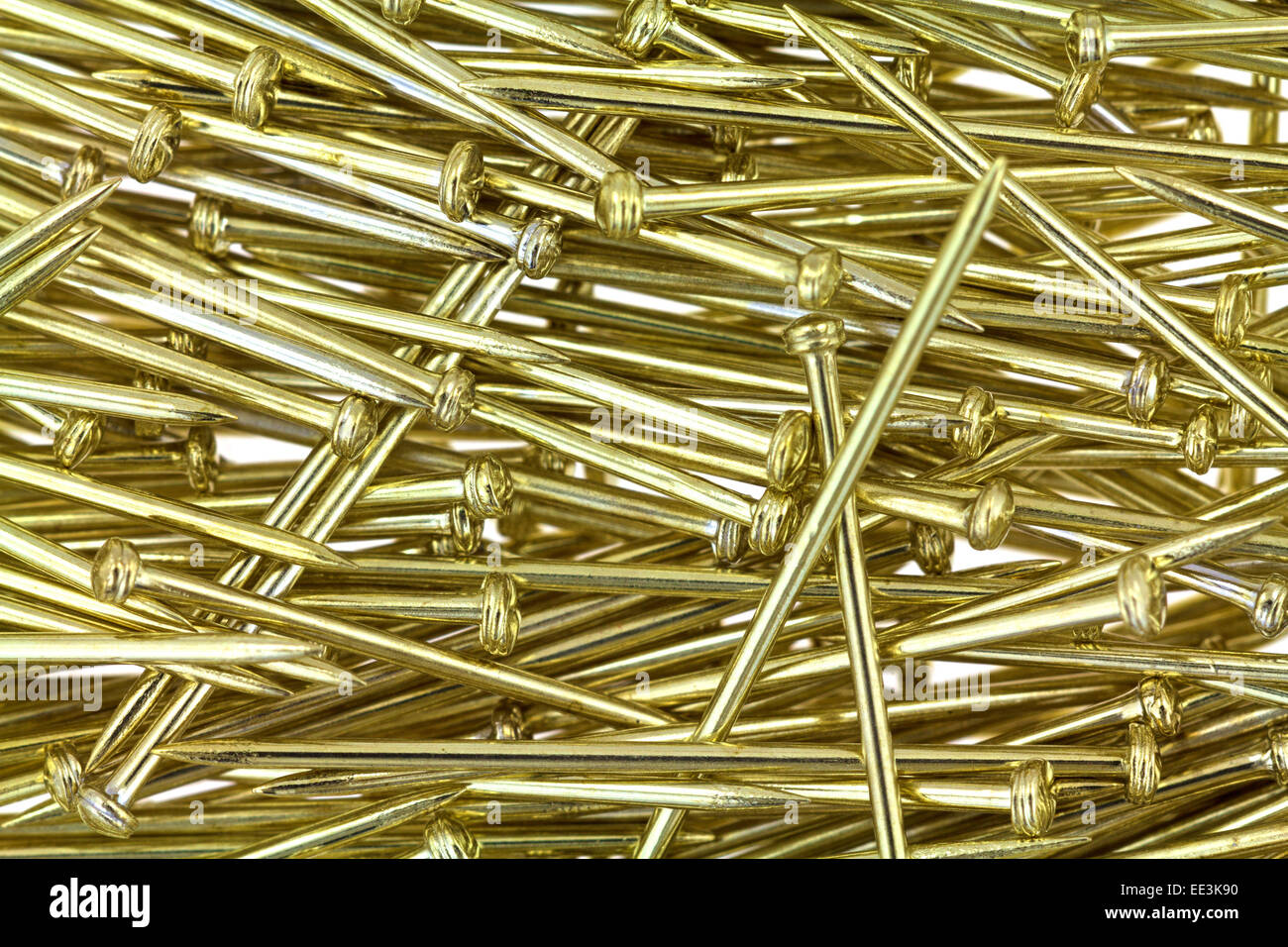 A very close view of small gold sequin pins for arts and crafts Stock ...
